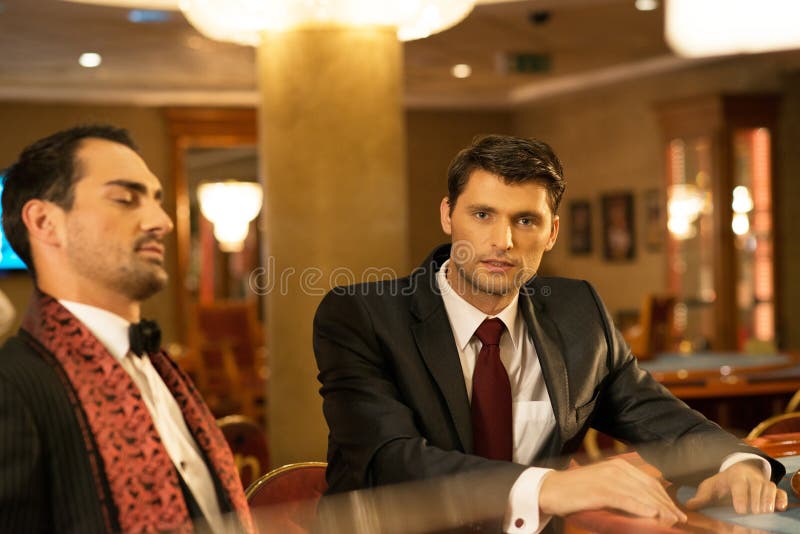 Two Young Men Behind Gambling Table Stock Photo - Image of play ...