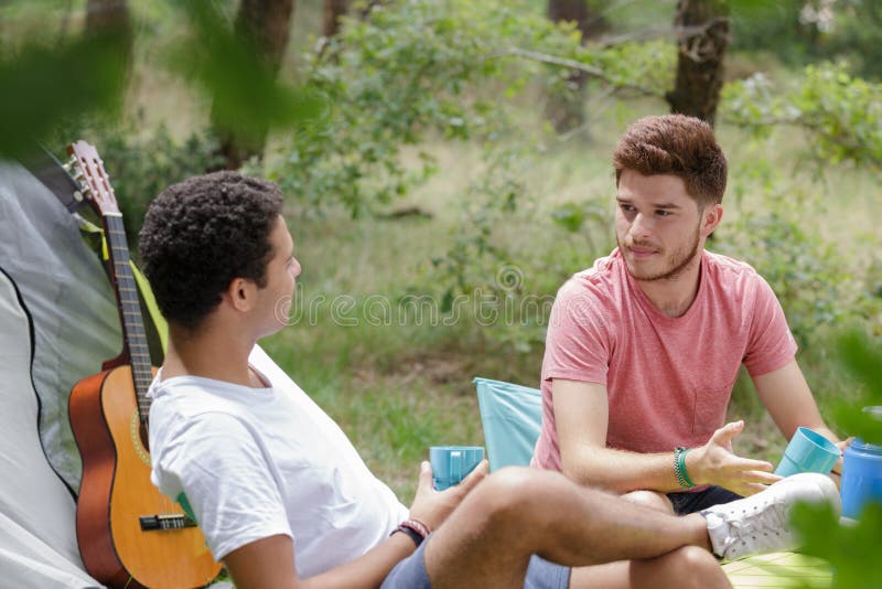 Two young men camping stock image. Image of enjoying - 186137501