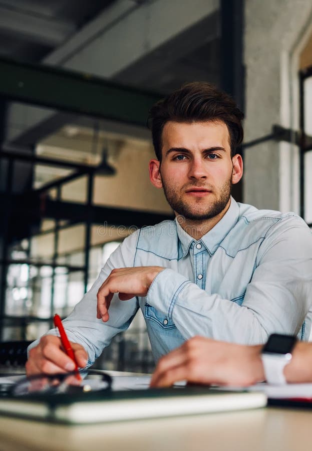 .Two Young Men Cooperating on Common Task Sitting at Desktop on Courses ...