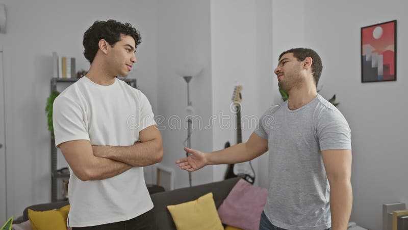 Two Young Men Engaging in Friendly Interaction Inside a Modern Living ...