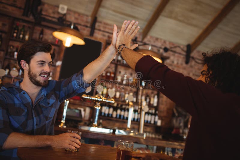 Two Young Men Giving High Five To Each Other Stock Photo - Image of ...
