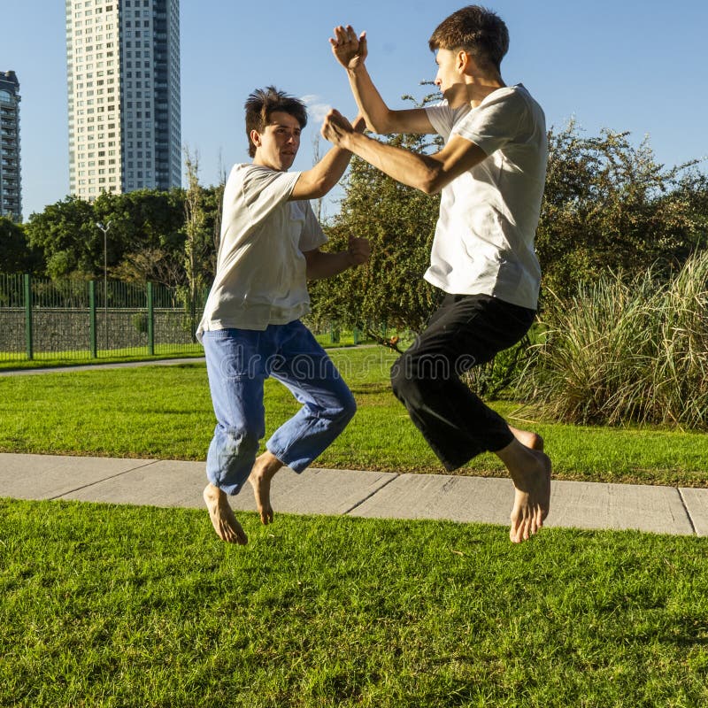 Two Young Men Performing Aerial Taekwondo Kicks Stock Photo - Image of ...