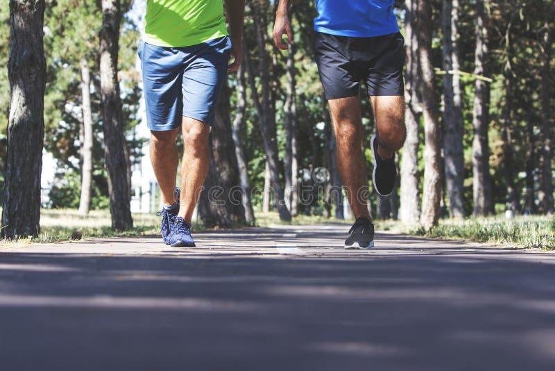 Two Young Men Running in the Park. Stock Image - Image of jogging ...