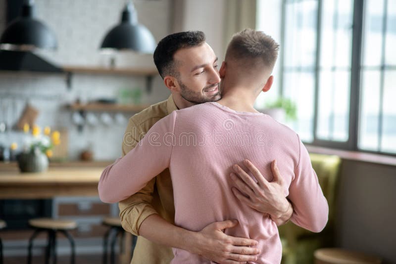 Two Young Men Standing and Hugging Each Other Stock Image - Image of ...