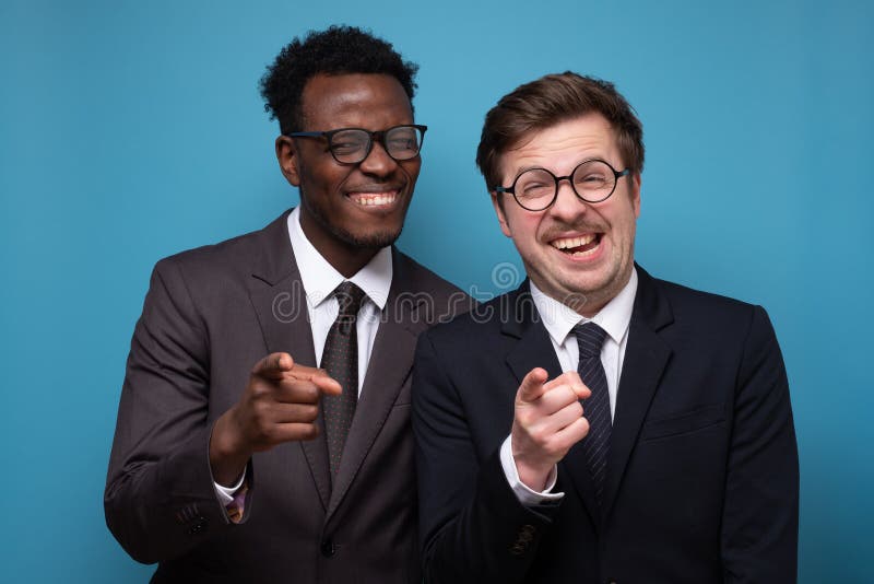 Two Young Men in Suits Posing with Folded Arms and Smiling To the ...
