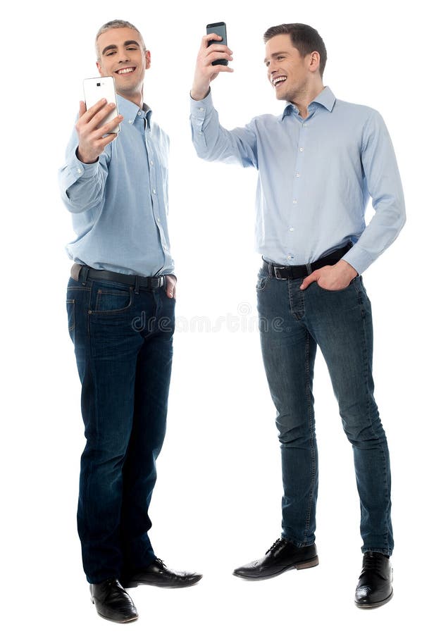 Two Young Men Using Their Phone Stock Photo - Image of camera, connect ...