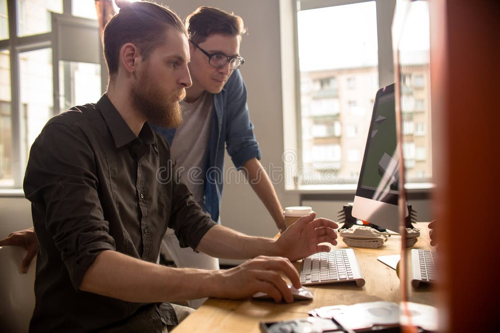 Two Young Men Working with Computer Stock Image - Image of project ...