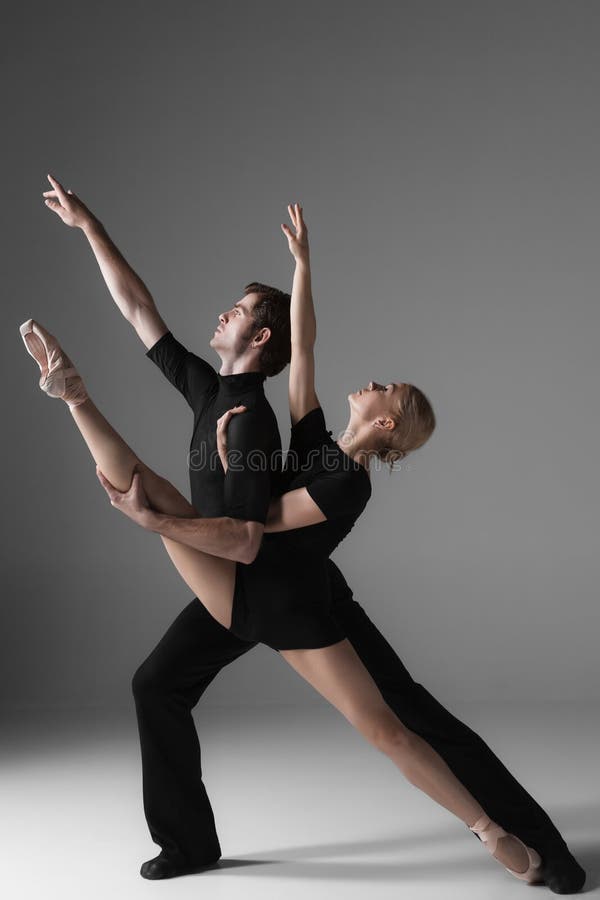Two Young Modern Ballet Dancers On Gray Studio Stock Photo - Image of ...