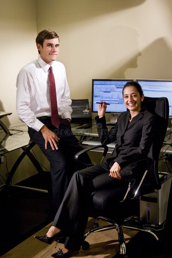 Two young office workers stock photo. Image of smiling - 10549674