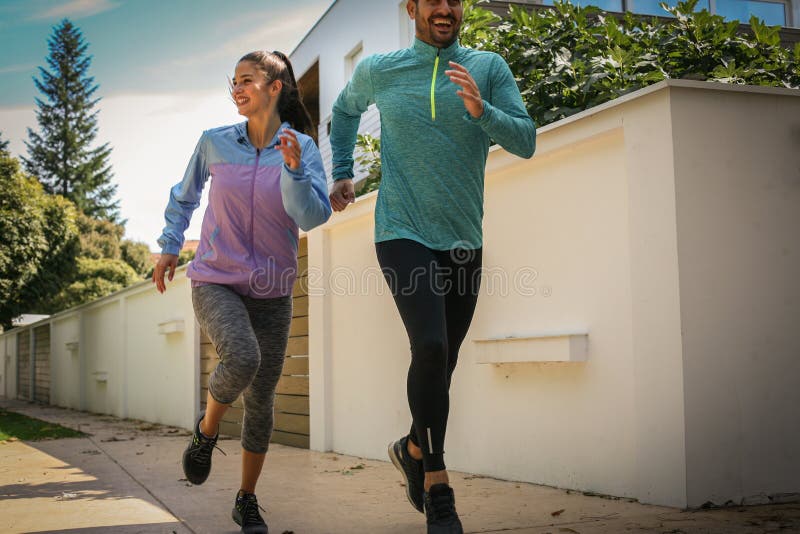 Two Young People Exercise Together Outside. Stock Image - Image of ...