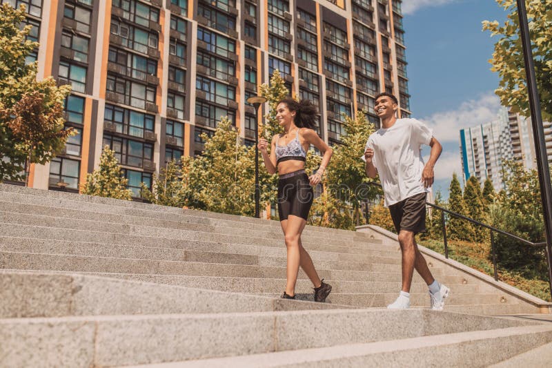 Two Young People Having a Run Together Stock Image - Image of team ...