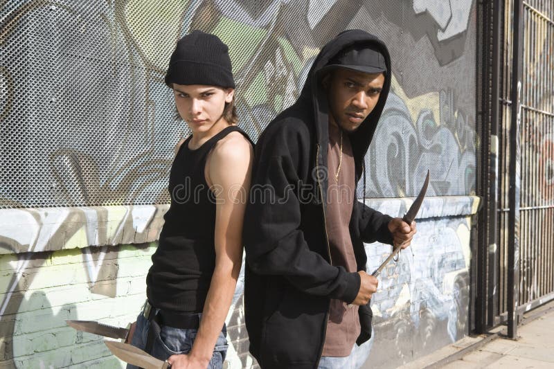 Two Young People with Knives Stock Photo - Image of knives, knife: 29665702