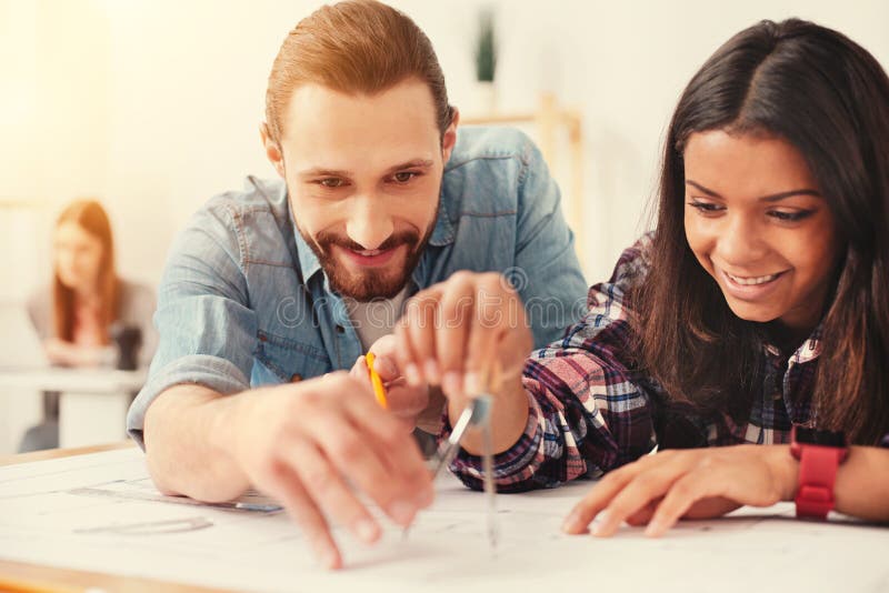 Two Young People Measuring the Distance on a Scheme Stock Photo - Image ...