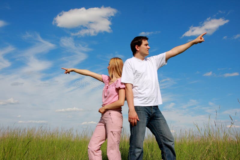 Two Young People Pointing Fingers Stock Image - Image of cloud, grass ...