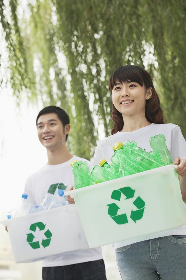 Two Young People Recycling Plastic Bottles Stock Photo - Image of ...