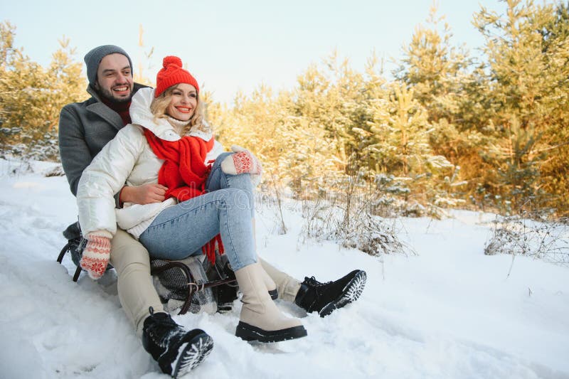 Two Young People Sliding on a Sled Stock Image - Image of mountain ...