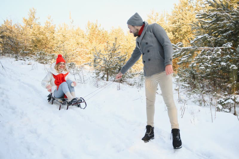 Two Young People Sliding on a Sled Stock Photo - Image of outdoors ...