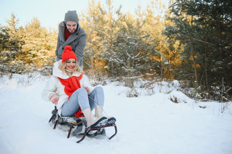Two Young People Sliding on a Sled Stock Image - Image of cute ...