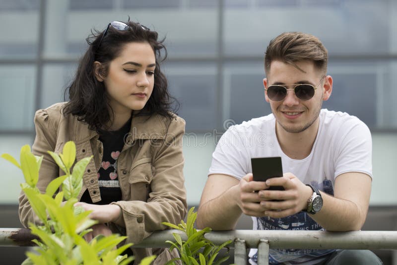 Two Young People, Students, Faculty and Stand in Front Using Mob Stock ...
