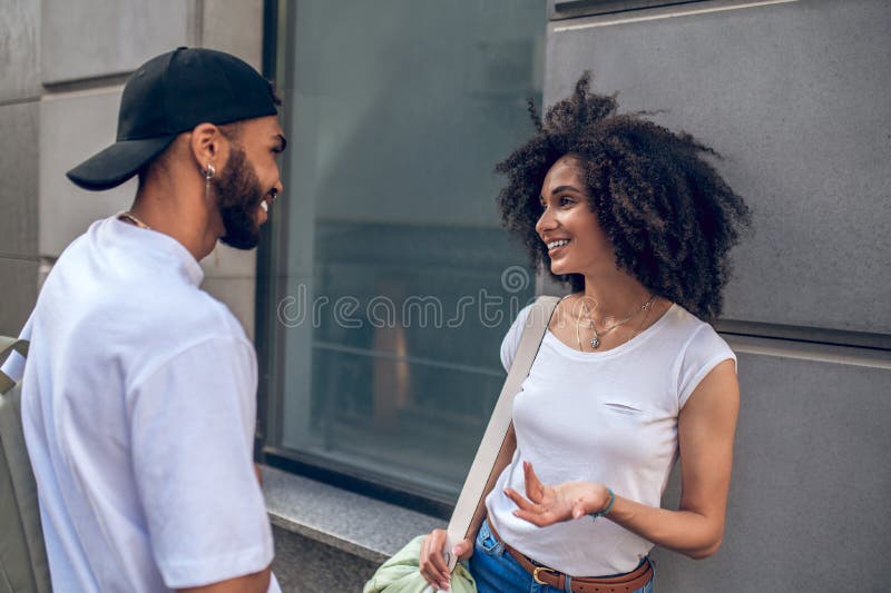 Two Young People Talking and Looking Involved Stock Photo - Image of ...