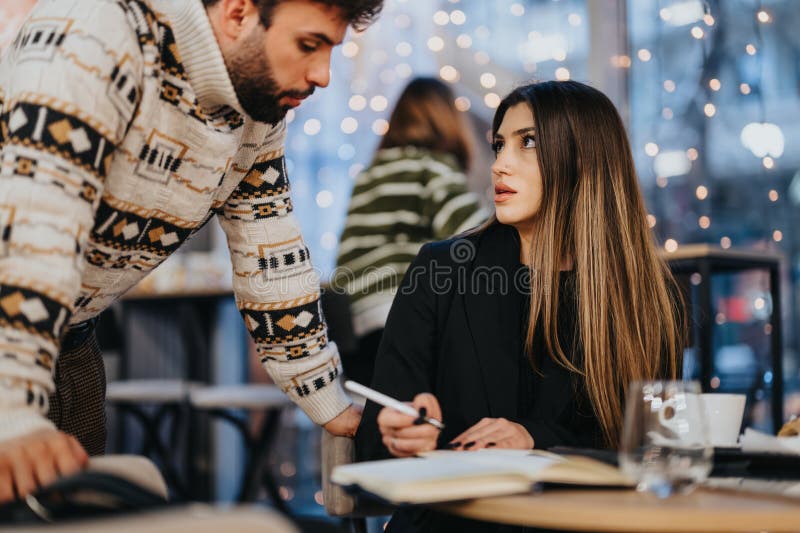 Two Young People Work Together in an Inviting, Warm-lit Space with ...