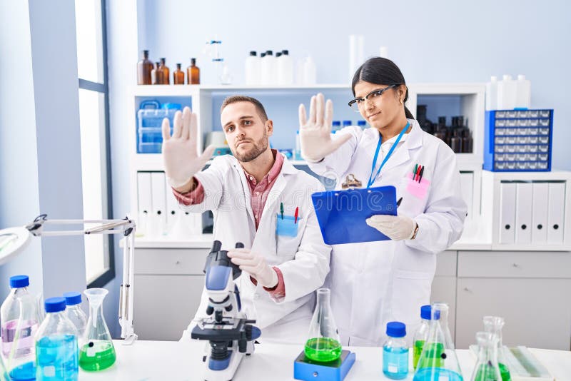 Two Young People Working at Scientist Laboratory with Open Hand Doing ...