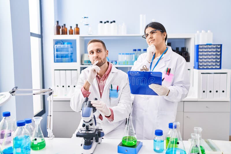 Two Young People Working at Scientist Laboratory Serious Face Thinking ...