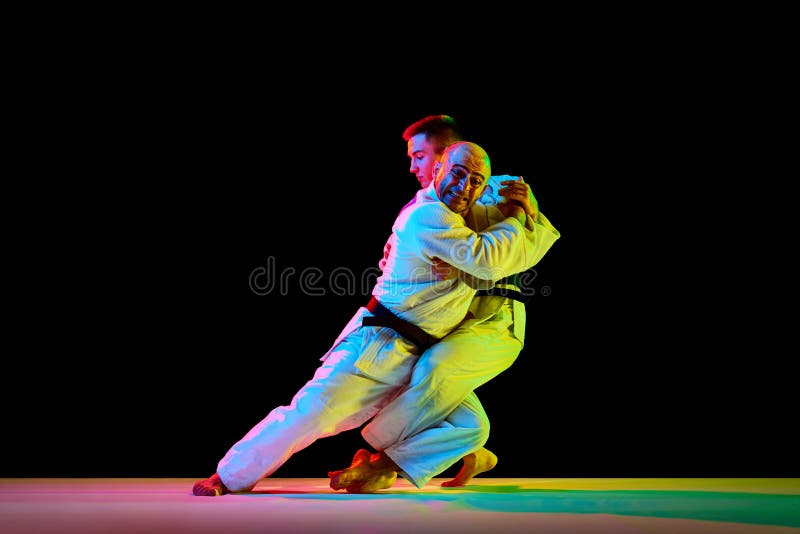 Two Young Professional Karate Men Fighting, Performing Technical Skill ...