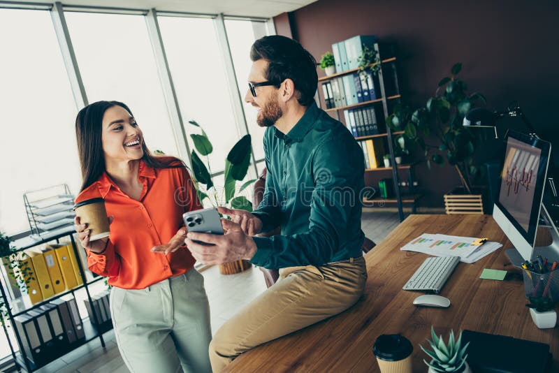 Two Young Professionals Collaborating in a Modern Office Setting ...
