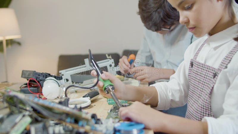 Two Young Schoolmates Doing Project in Engineering Together Stock Video ...