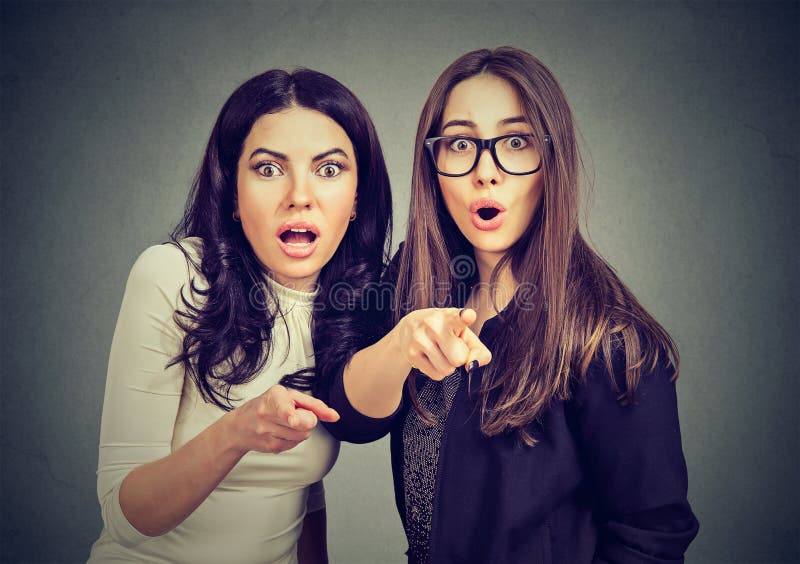 Two Young Shocked Women are Scared about Something Pointing Fingers at ...