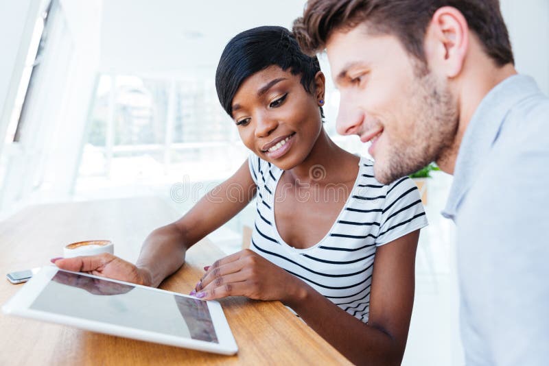 Two Young Smart Happy Businesspeople Working with Tablet Stock Image ...