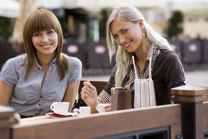 Beautiful Young Women Drinking Coffee at Cafe Stock Photo - Image of ...