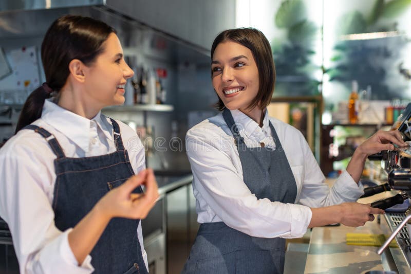 Two Young Smiling Shop Assistants Working and Feeling Confident Stock ...
