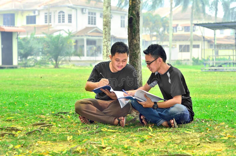 Two Young Student Reading Books Stock Image - Image of casual, park ...