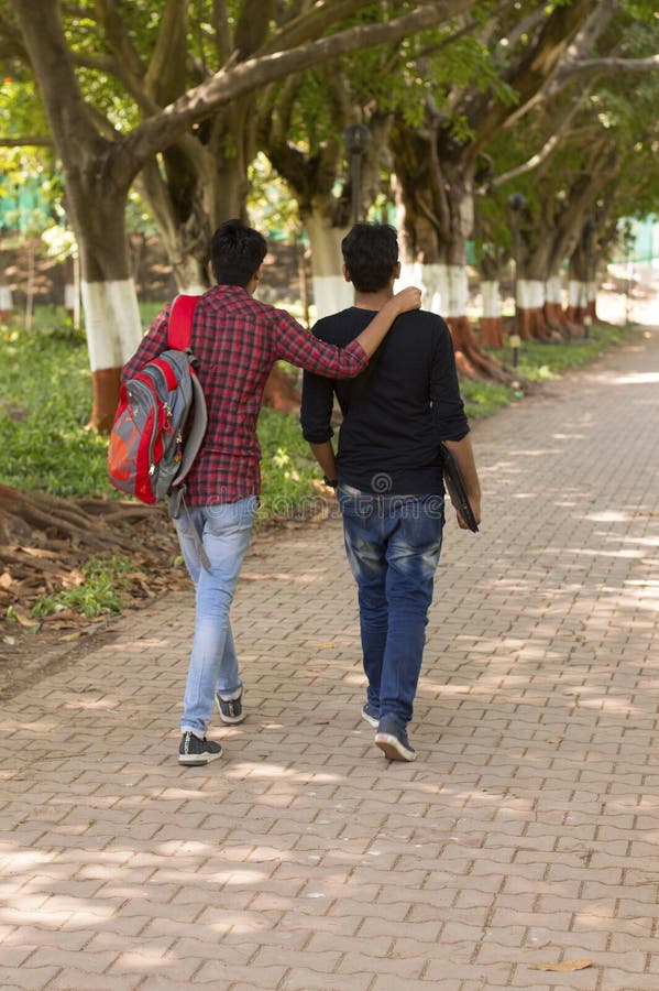 Two Young Students Going To College and on Shoulder Stock Photo - Image ...