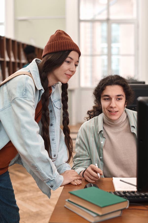 Two Young Students in Library Using Computer Stock Image - Image of ...
