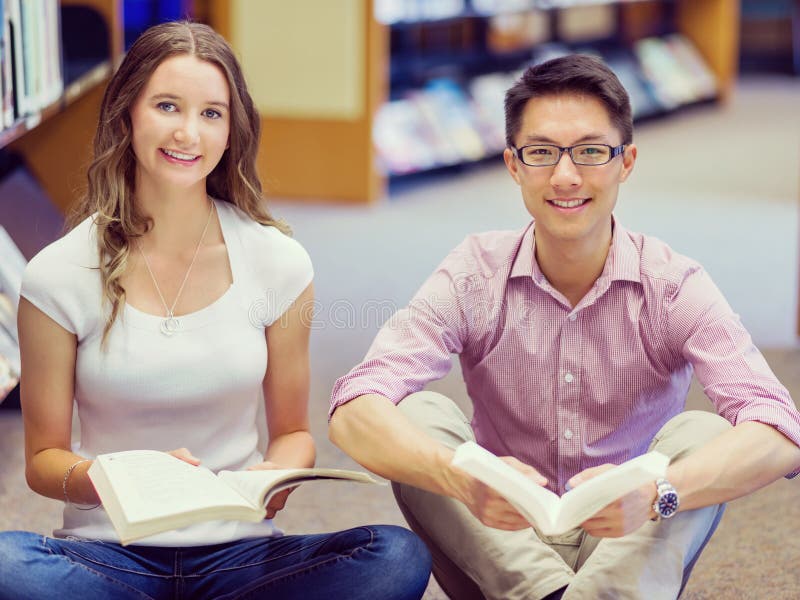 Two Young Students at the Library Stock Photo - Image of searching ...