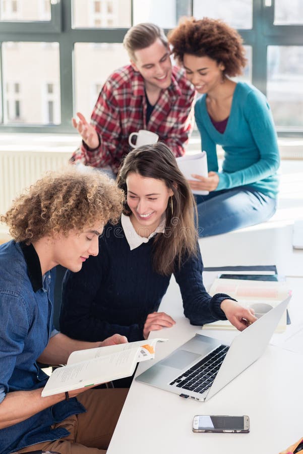 Two Young Students Searching for an Answer To Their Question Stock ...