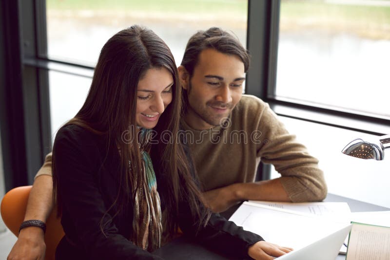 Two Young Students Studying Together in Library Stock Photo - Image of ...