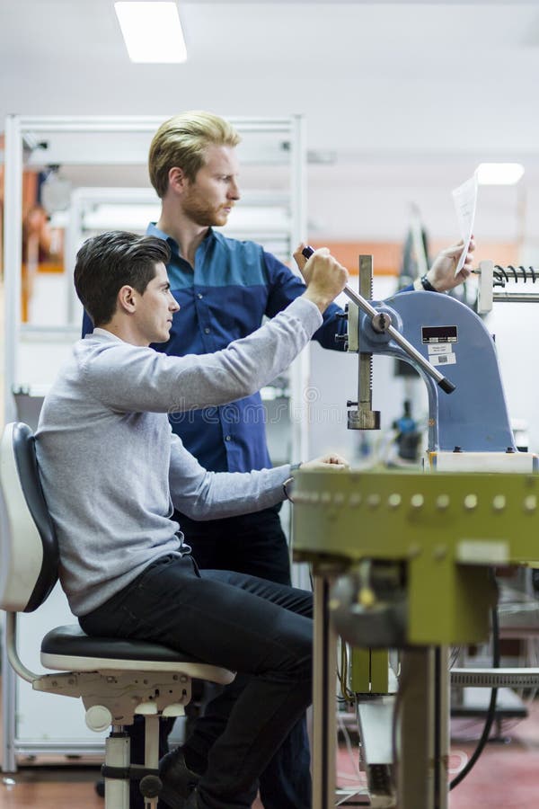 Two Young Students Working on a Project Together in Lab Stock Image ...