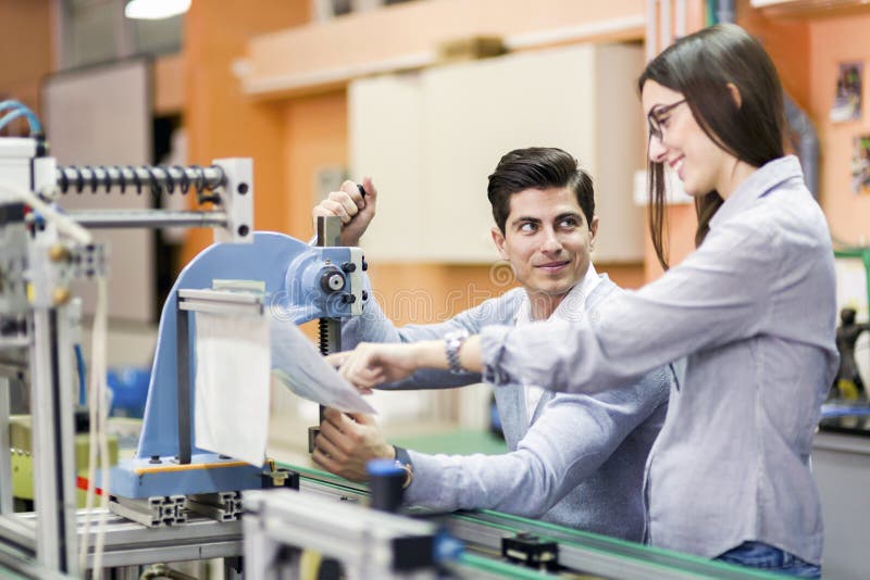 Two Young Students Working on a Project Together in Lab Stock Photo ...