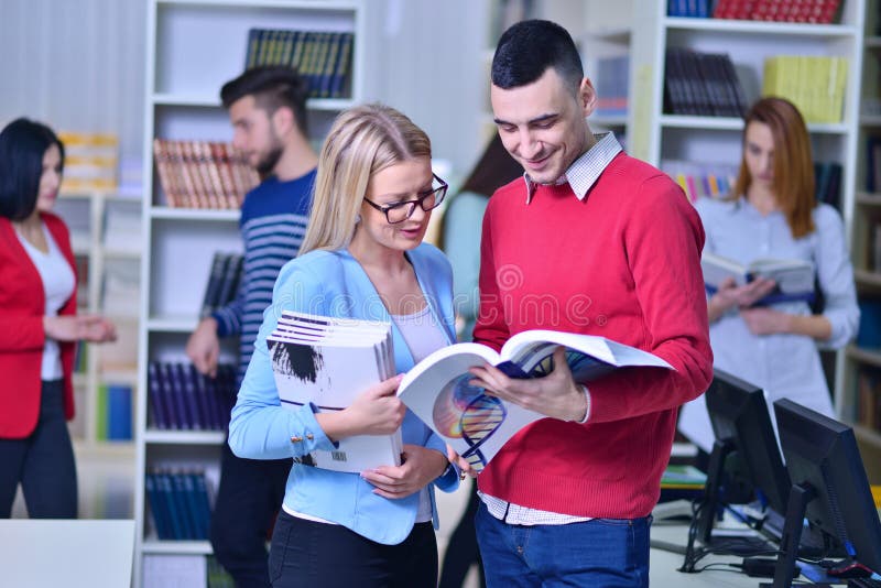 Two Young Students Working Together at the Library Stock Image - Image ...