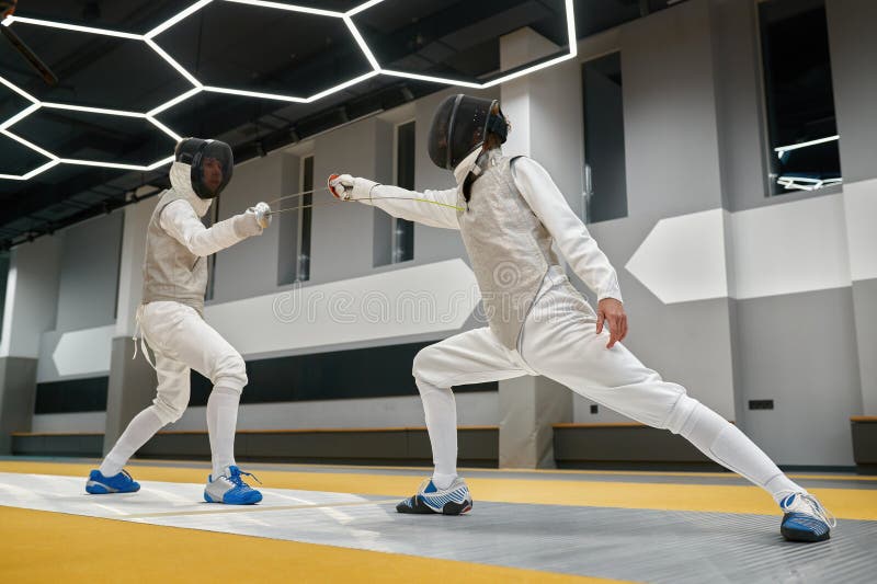 Swordsman Standing in Fencing Lunge during Training Fight in Fencer ...