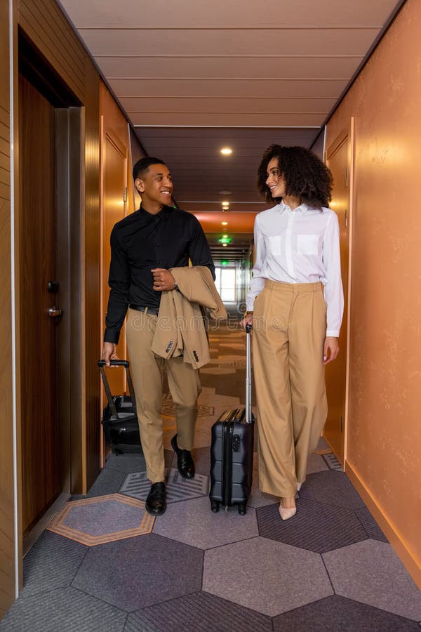 Two Young Well-dressed People Going To Their Rooms in the Hotel Stock ...