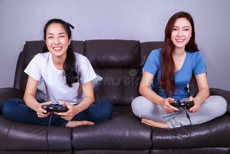 Two Young Woman Using Joystick Controller Playing Video Game on Stock ...