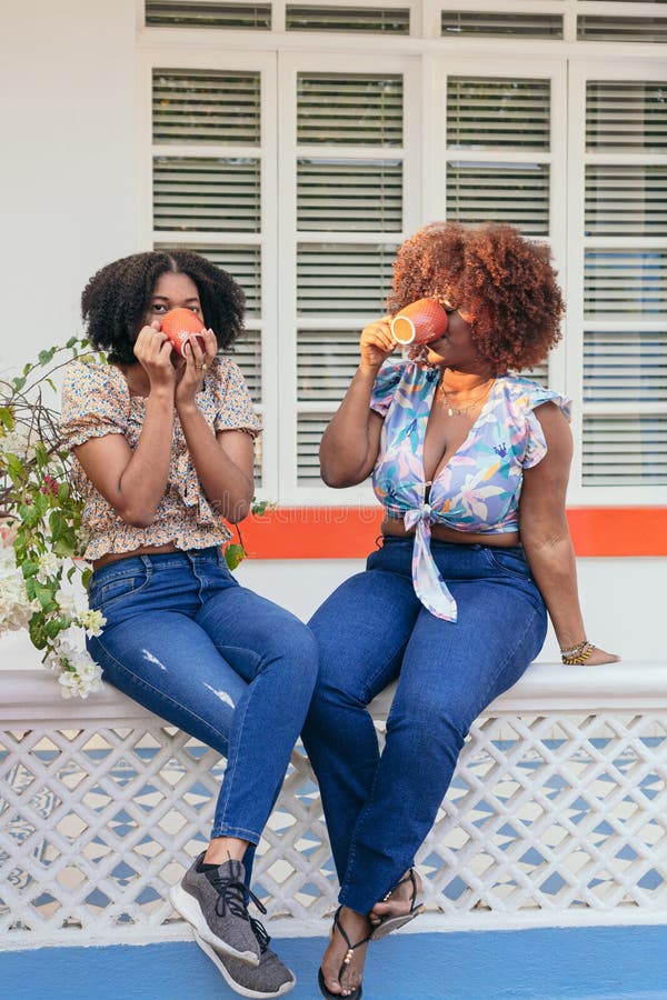 Two Young Women Chatting during Coffee Break Stock Photo - Image of ...
