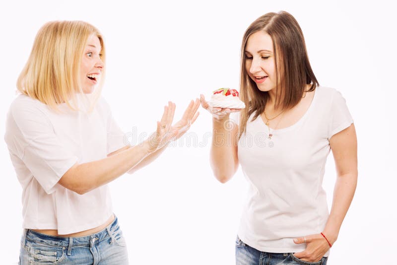 Two Young Women are Eating a Cake Stock Photo - Image of girls, closeup ...