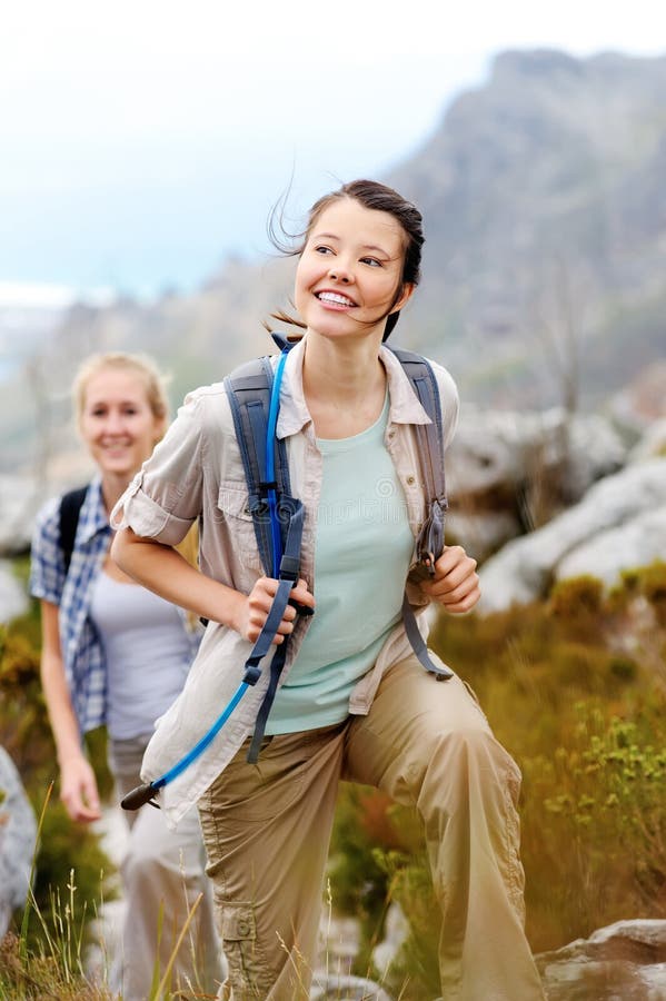 Backview of Two Young Women Hiking in Nature Stock Photo - Image of ...