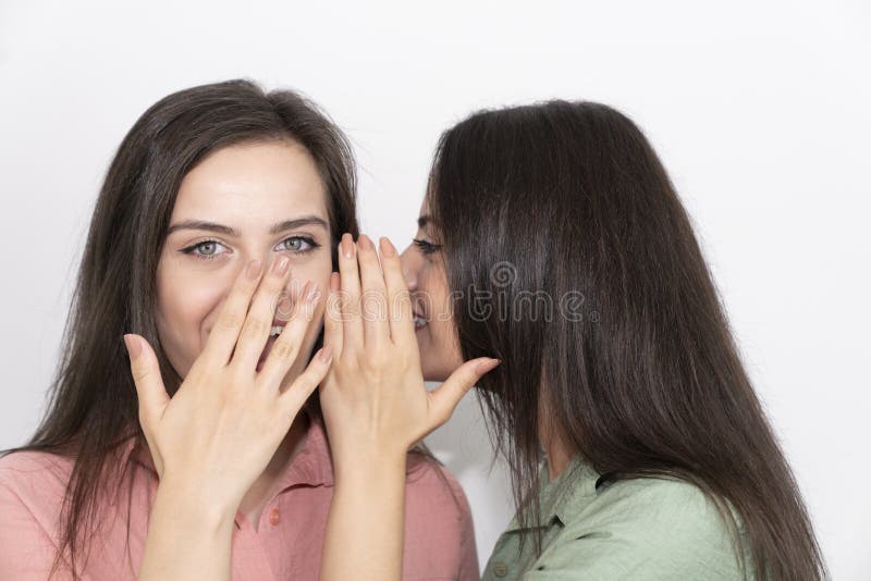 Two young women gossip stock photo. Image of news, face - 346697132